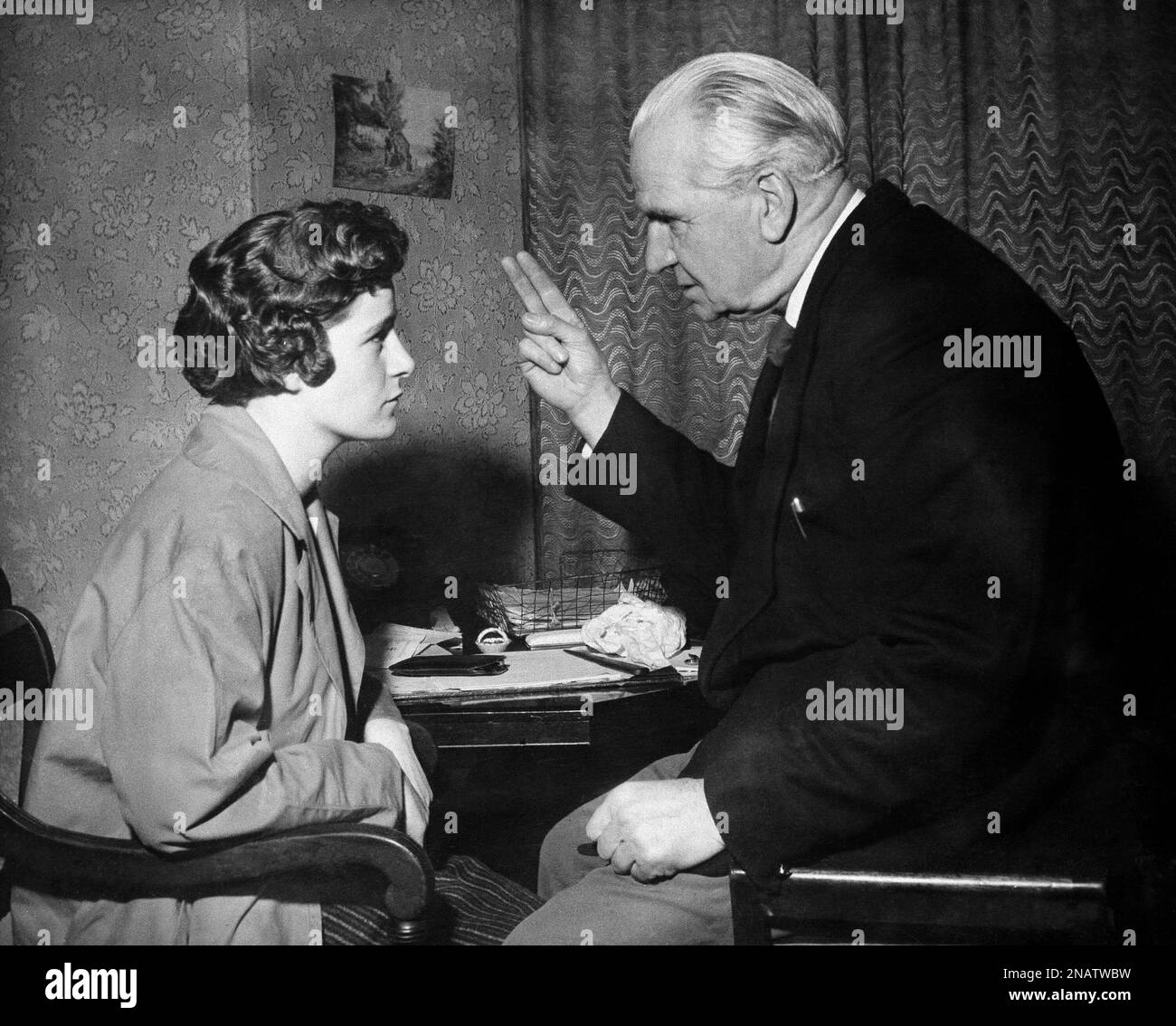 Henry Blythe hypnotizes his 17-year-old daughter, Sally at their home ...