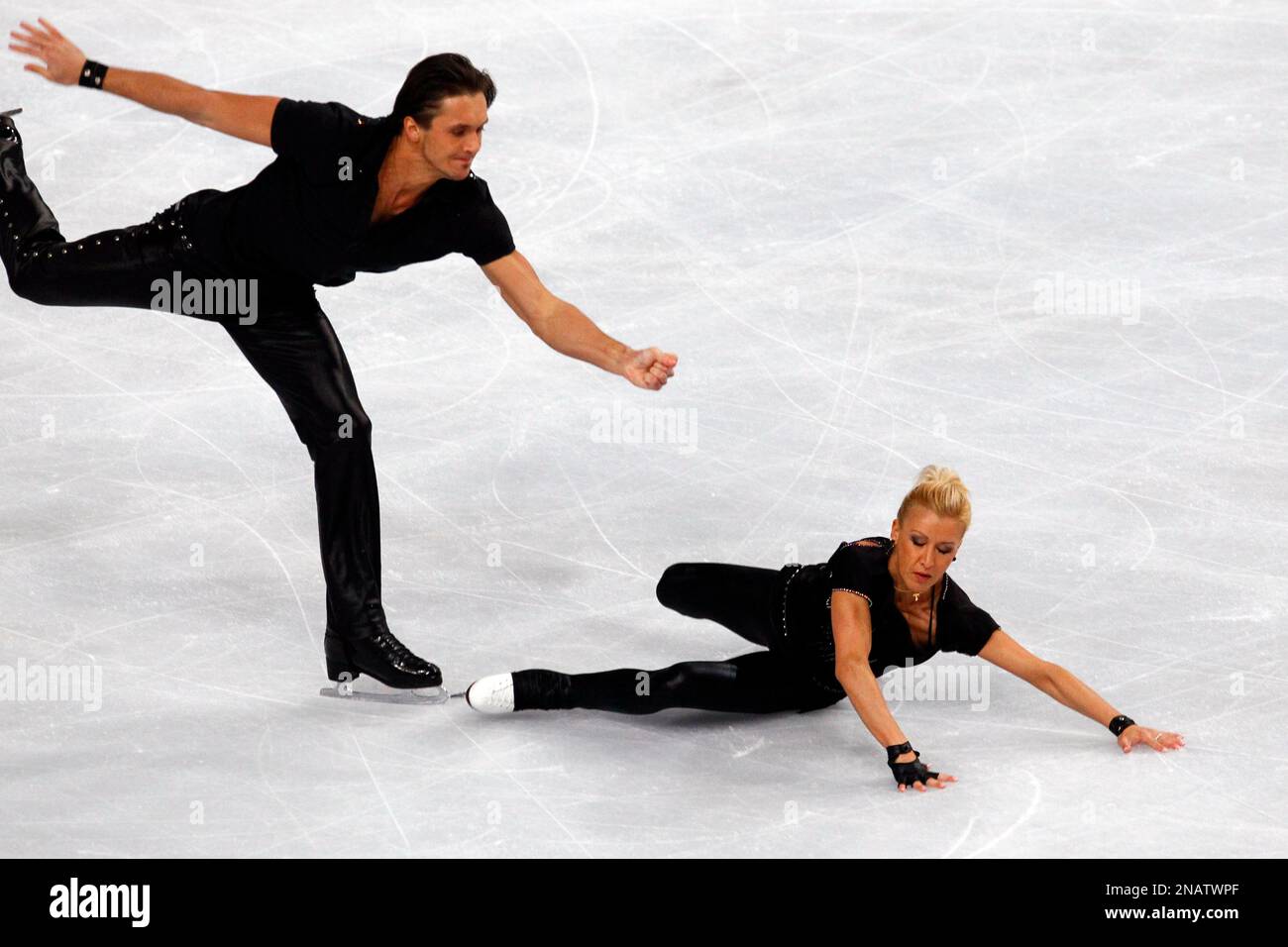 Tatiana Volosozhar and Maxim Trankov of Russia perform their Pairs ...