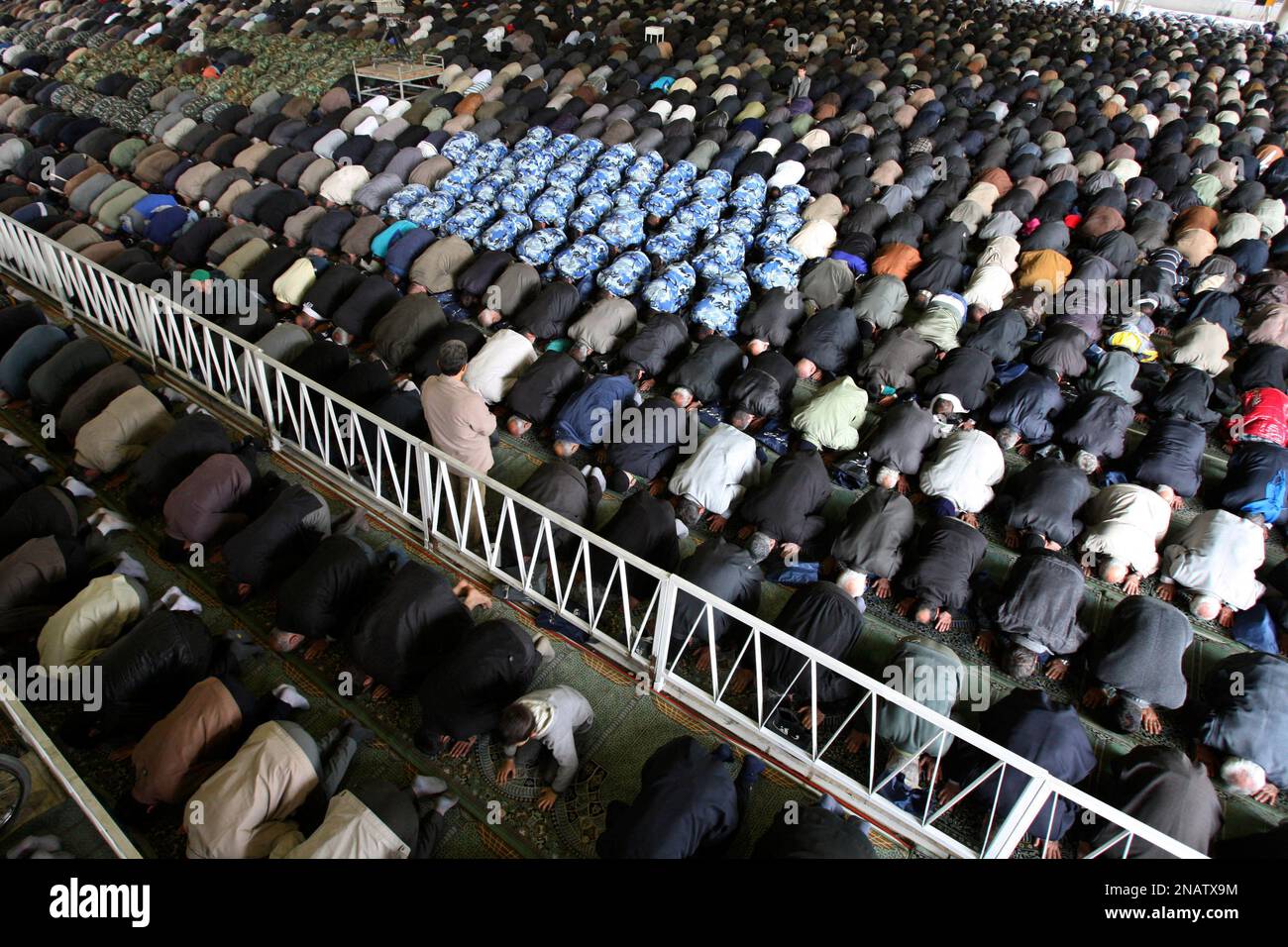 Iranian worshippers perform Friday prayers, at the Tehran University ...