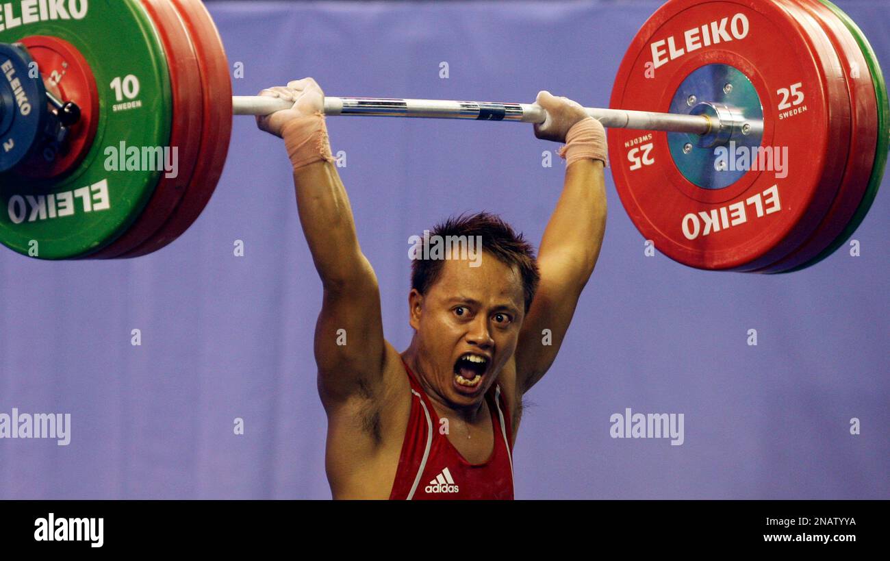Indonesia's Jadi Setiadi competes in the clean and jerk of the Men's 56 ...