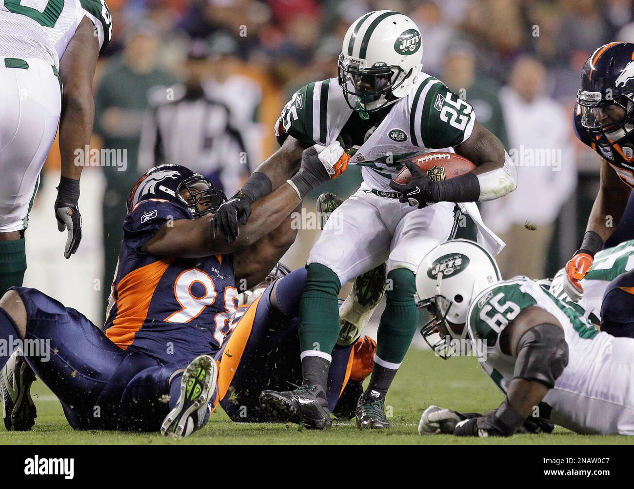 Denver Broncos defensive end Ryan McBean (98) pulls down New York Jets ...