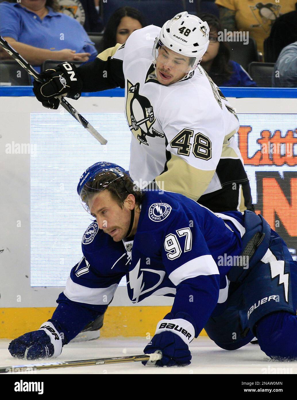 Pittsburgh Penguins center Tyler Kennedy (48) knocks down Tampa Bay ...