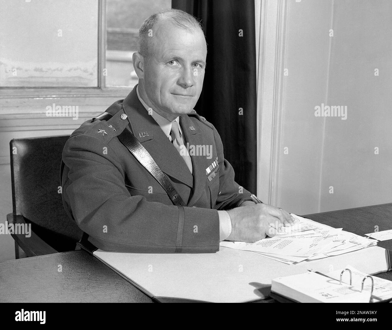 Major General J.C.H. Lee is shown at his desk in London, July 16, 1942 ...