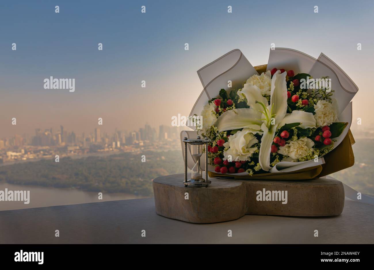 Hourglass or Sandglass is next to Bouquet of flowers placed on the ...