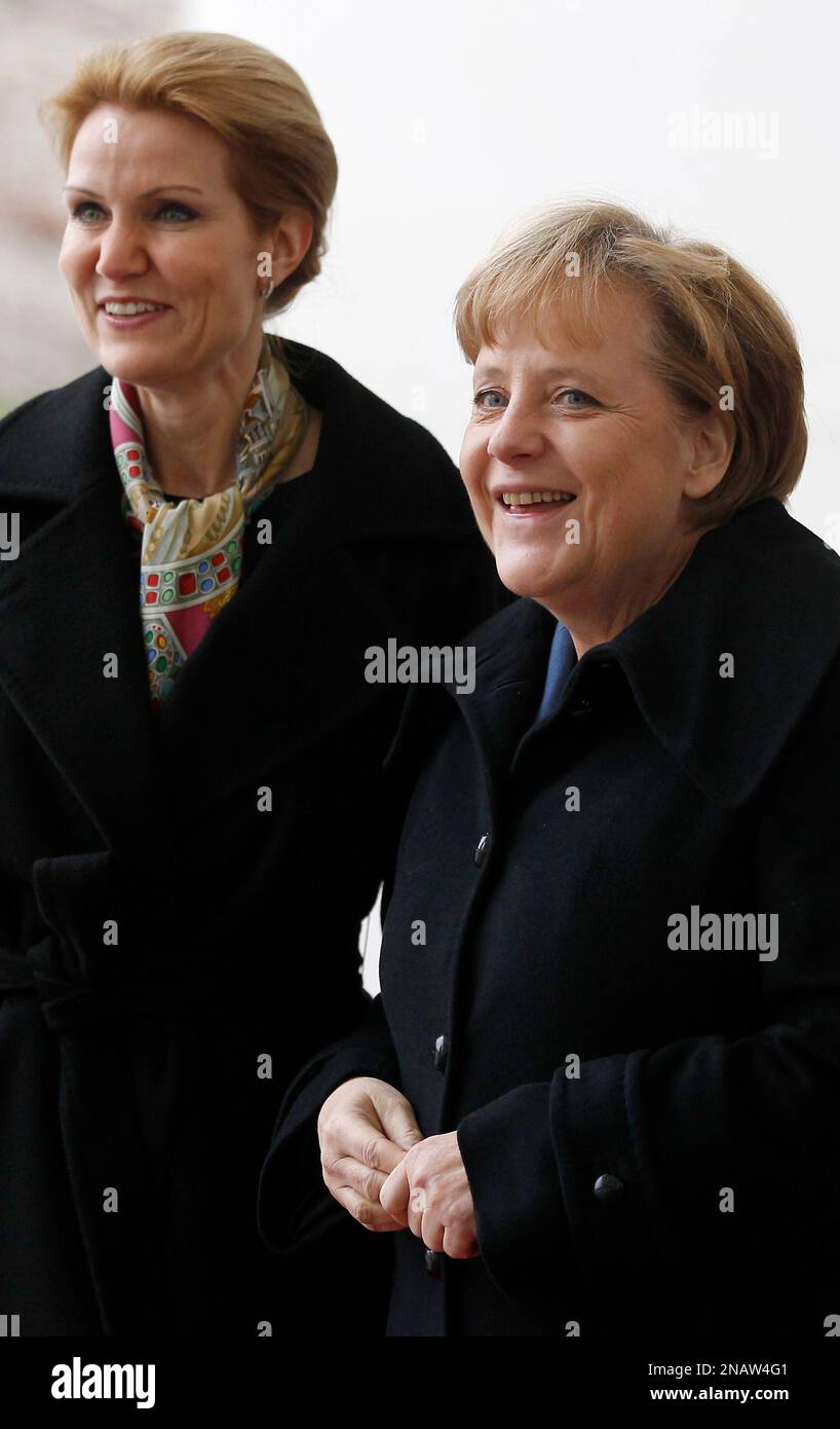 German Chancellor Angela Merkel, right, smiles as she welcomes Prime ...