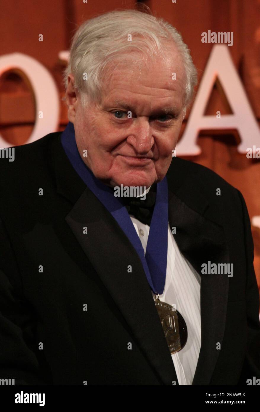 John Ashbery poses for photographs after being presented with the 2011 ...