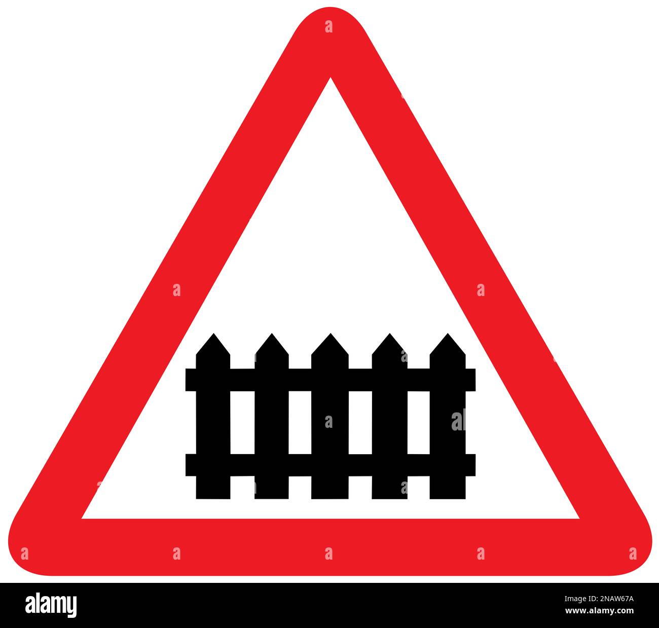 Level crossing with gate or barrier ahead British road sign Stock Photo ...