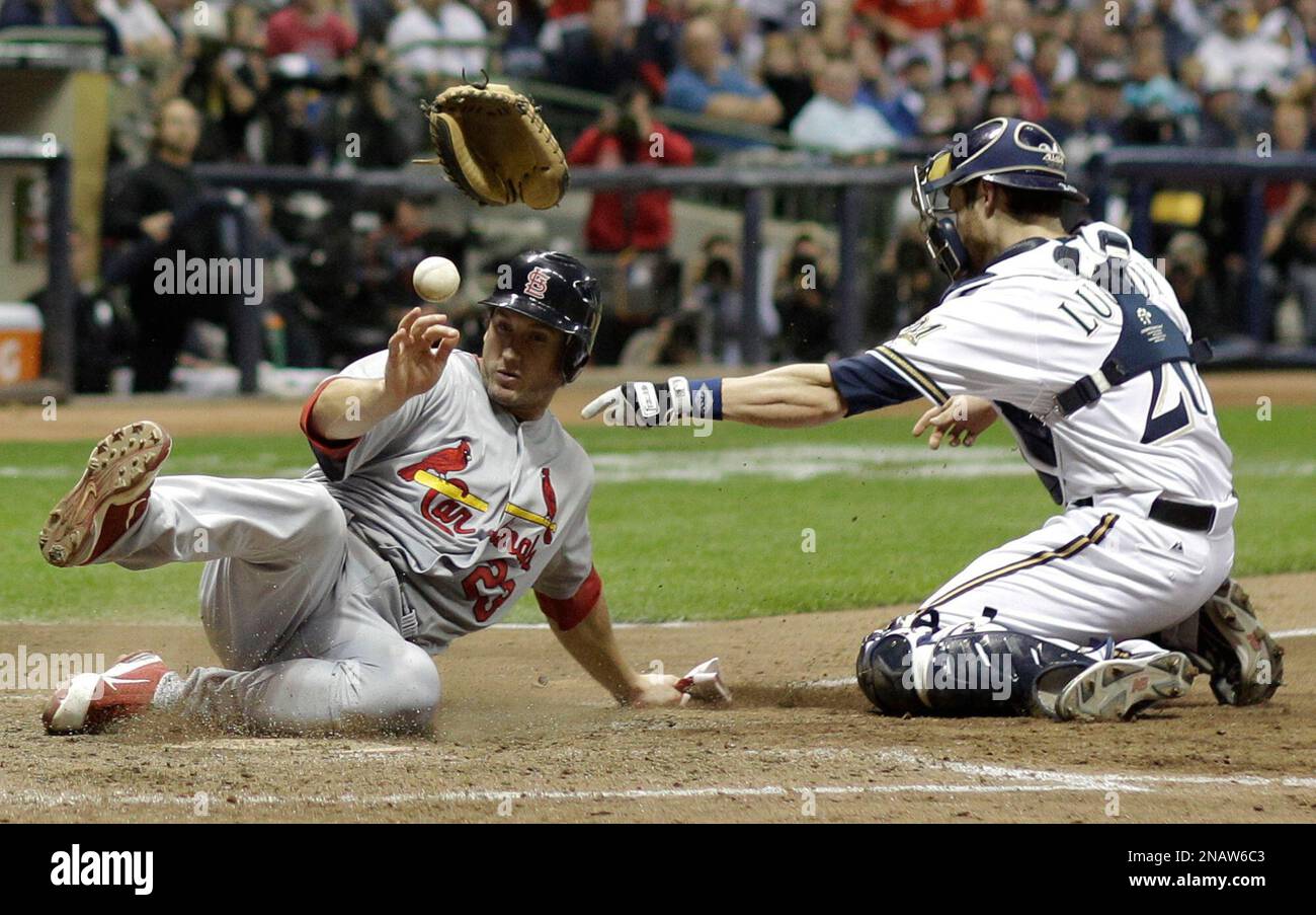 St. Louis Cardinals' David Freese (23) knocks the glove and ball away ...