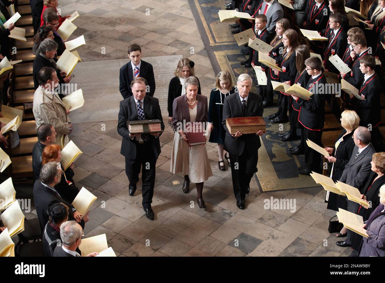 Ancient copies of the King James bible are carried in a procession to ...