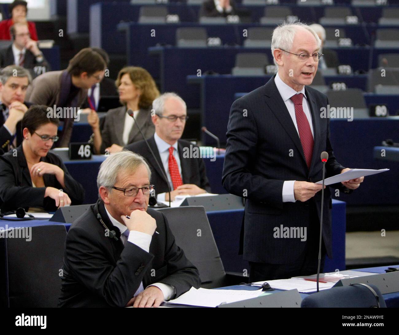 President of the European Council Hermann Van Rompuy, right, delivers ...