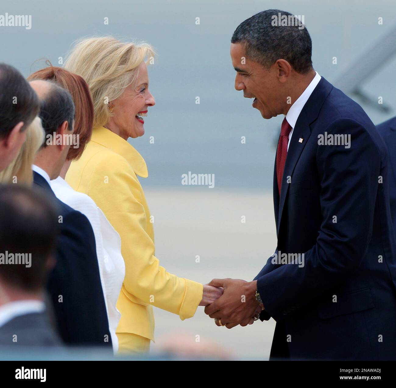 U.S. President Barack Obama, right, shakes hands with Governor General ...