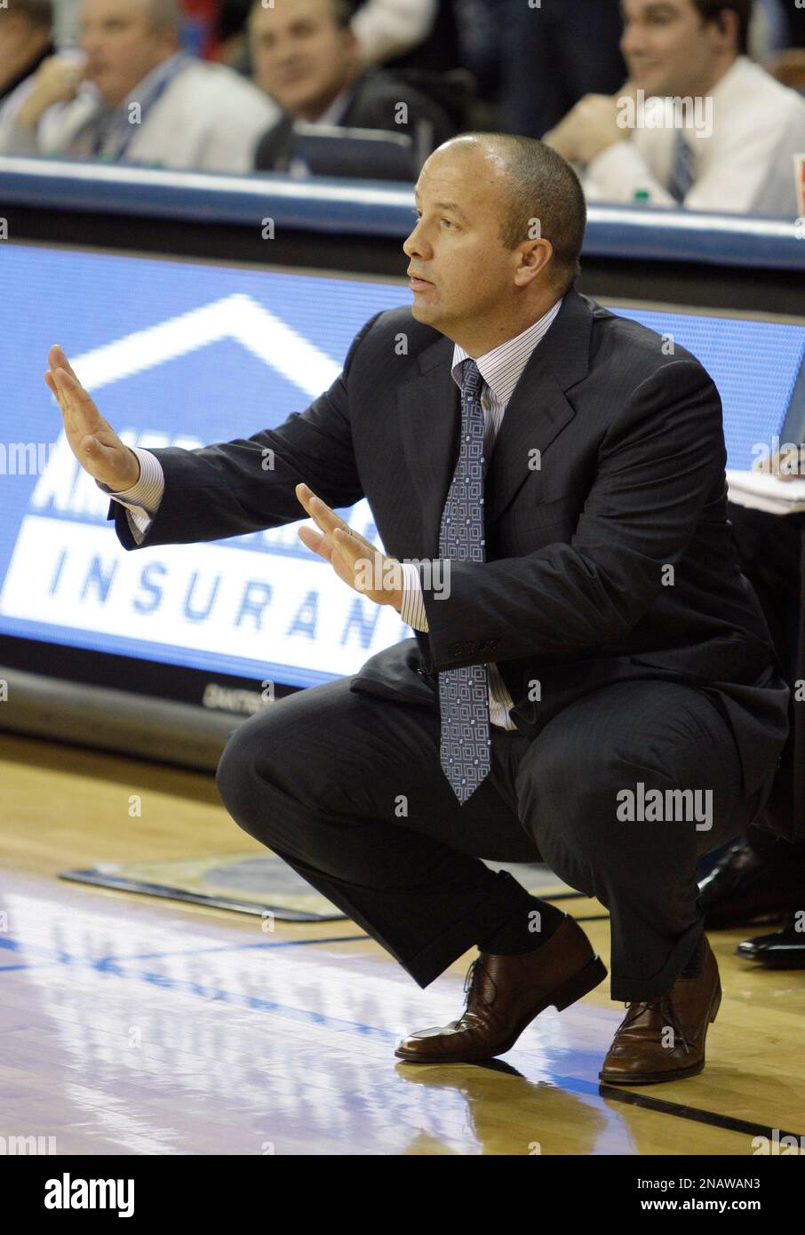 Drake coach Mark Phelps directs his team during the second half of an ...