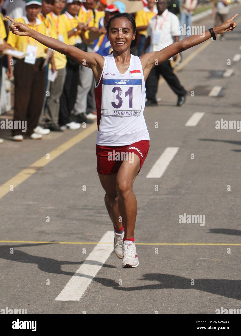 Indonesia's Triyaningsih celebrates after winning the women's marathon ...