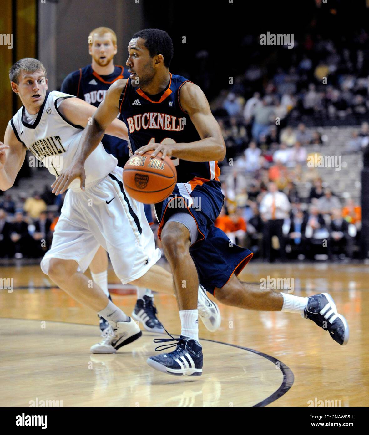 Bucknell guard Cameron Ayers (42) drives past Vanderbilt guard Brad ...