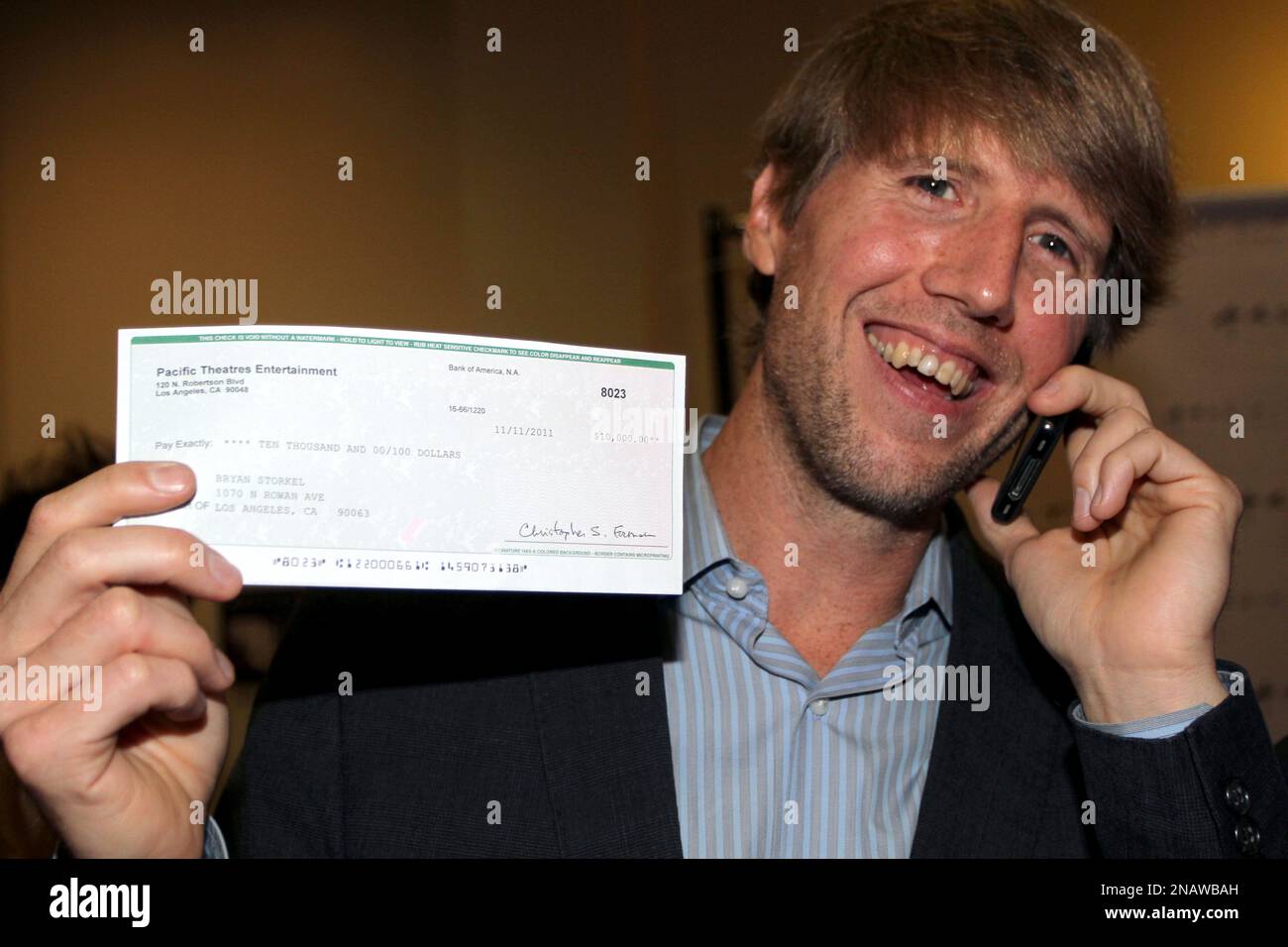 Filmmaker Jason Connell accepts a $10,000 check for the winning ...
