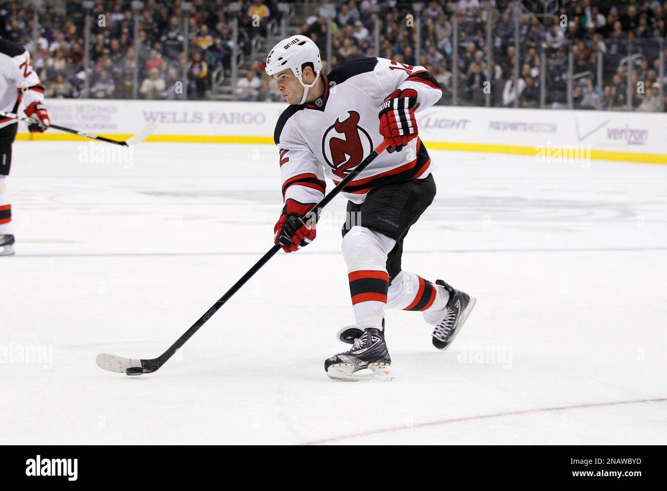 New Jersey Devils right wing Nick Palmieri goes to hit the puck during ...