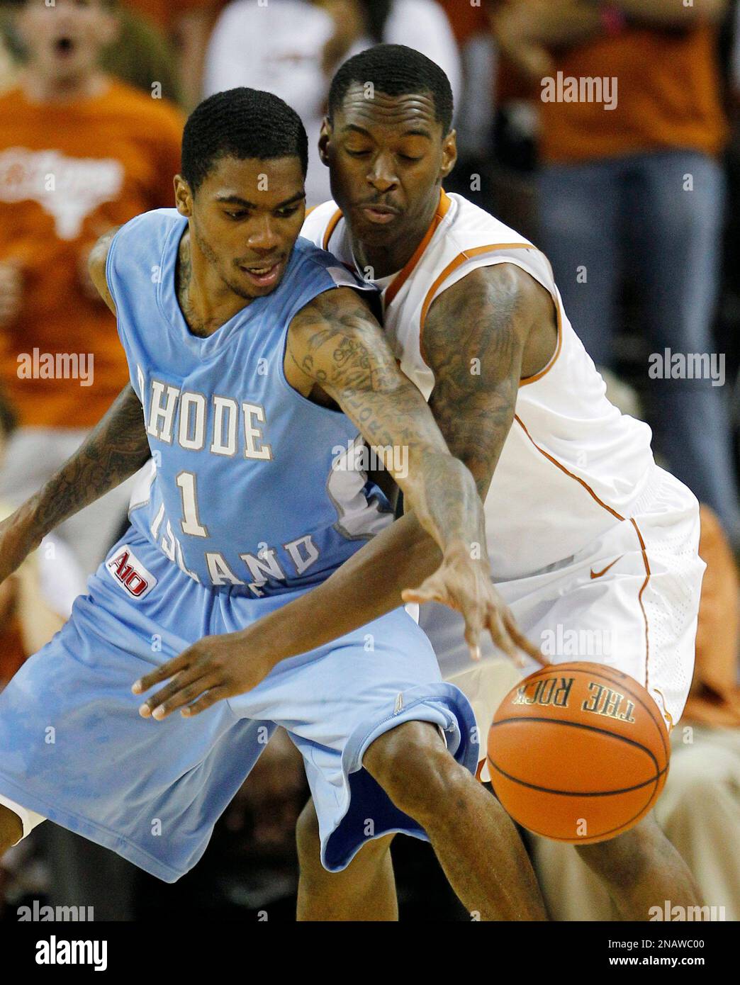 Rhode Island's Jamal Wilson, left, and Texas' Sheldon McClellan ...