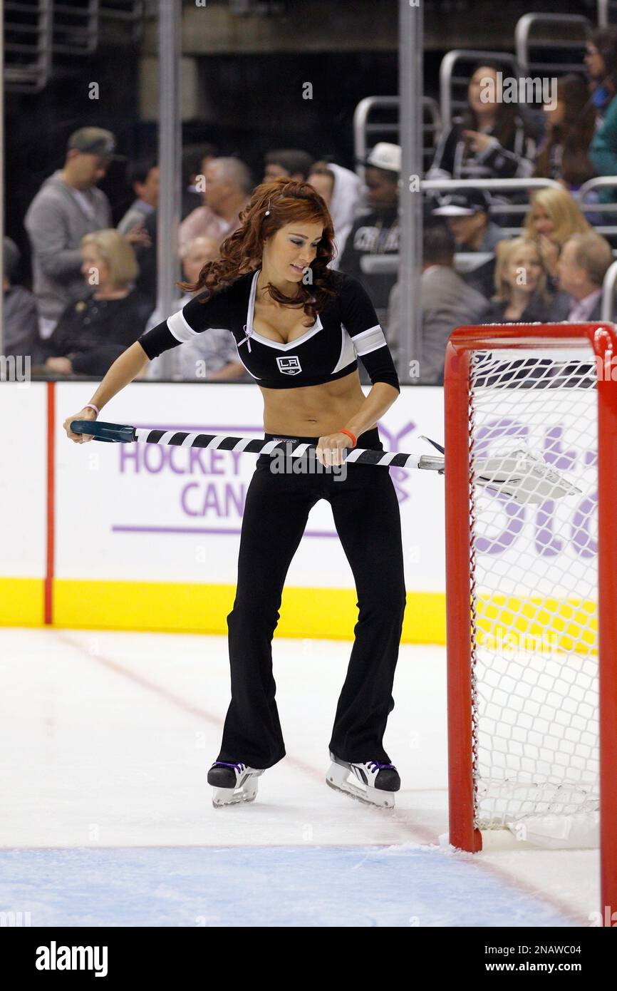 Los Angeles Kings Ice Girls grooms the ice during the second period of ...