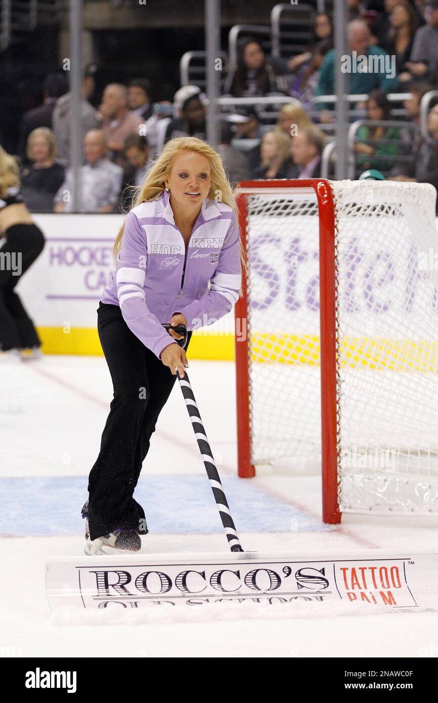 Los Angeles Kings Ice Girls grooms the ice during the second period of ...