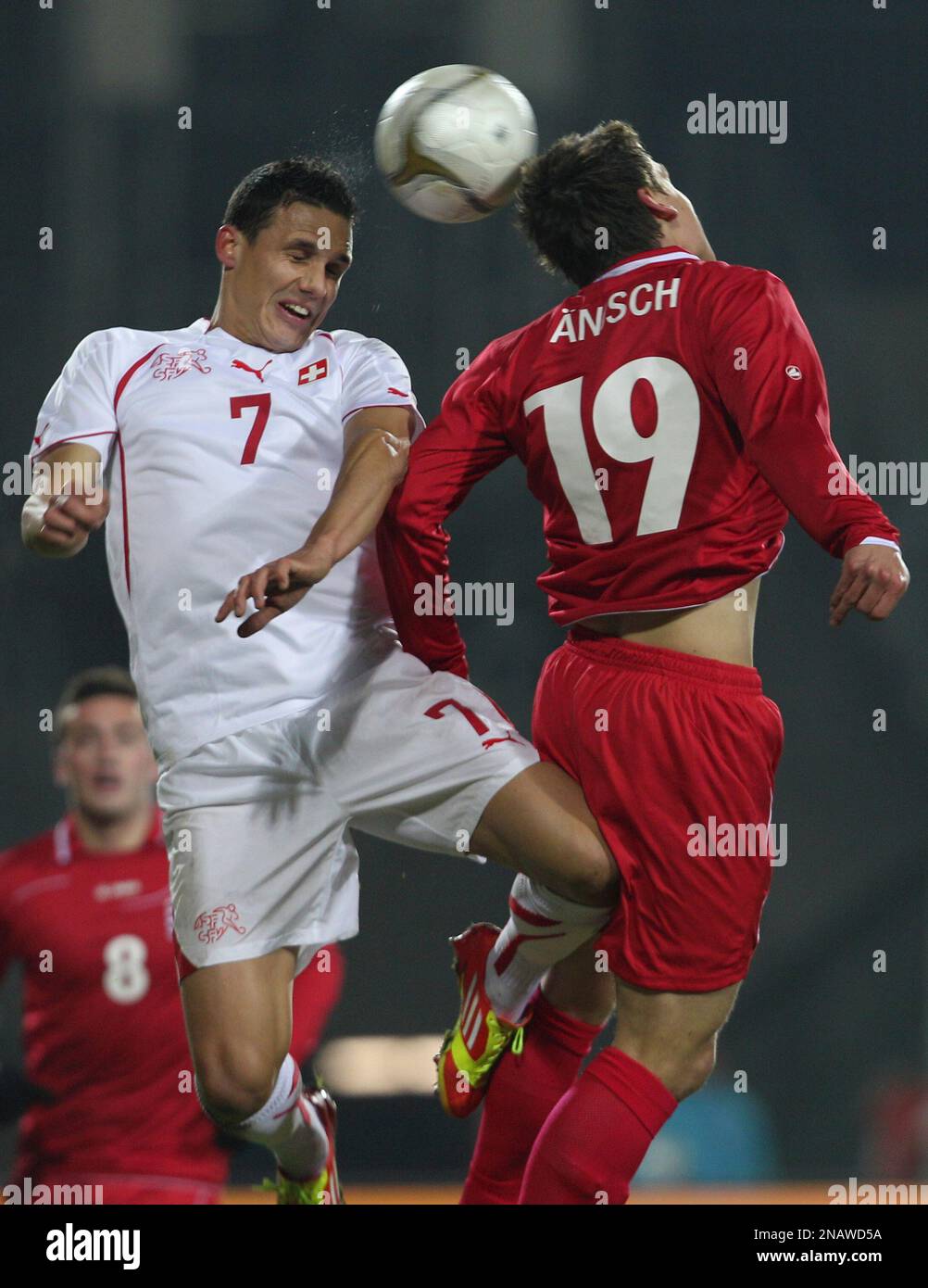 Switzerland's player David Degen, left, and Luxembourg's player Mathias ...