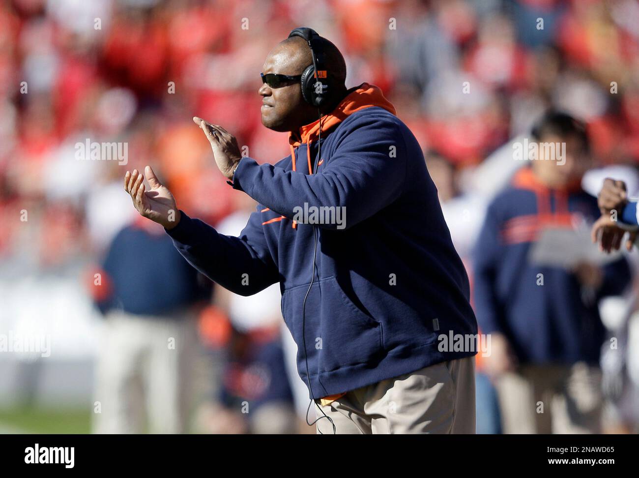 Virginia head coach Mike London applauds after a play in the first half ...