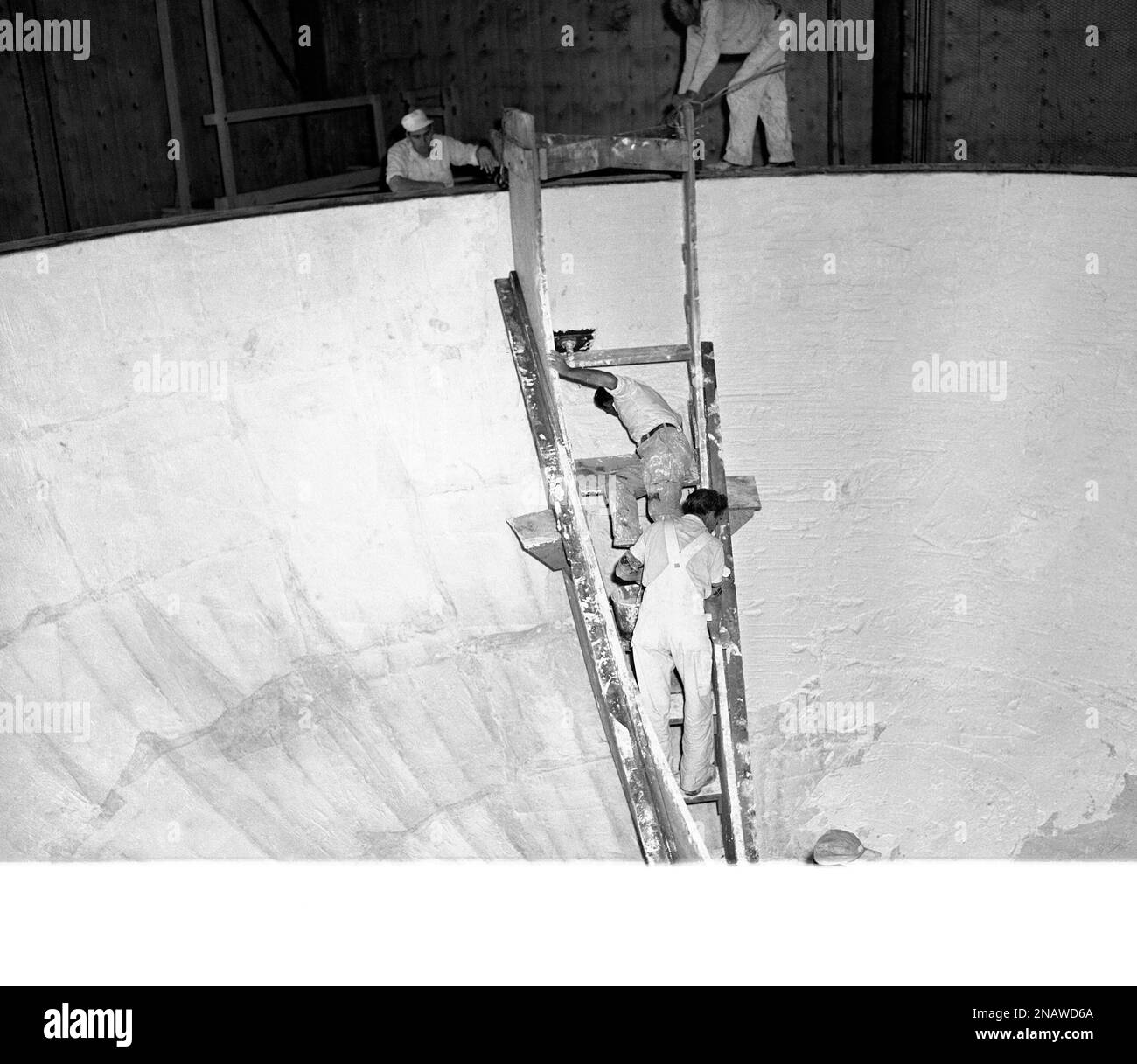 Workmen at Paramount Studio are making an experimental screen for ...