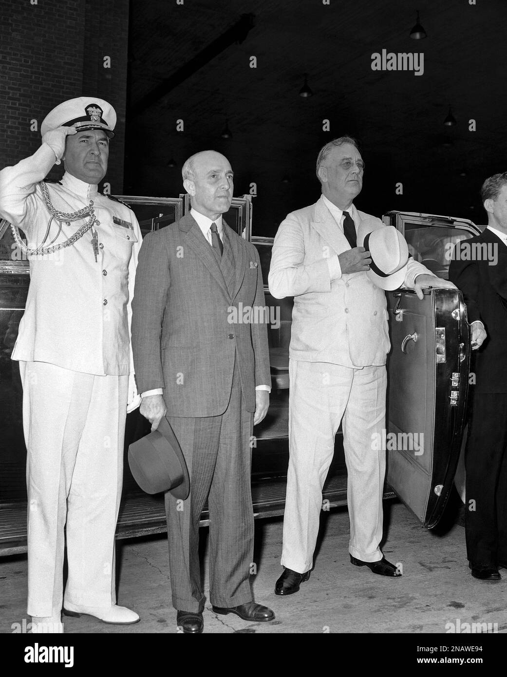 Their heads bared, President Manuel Prado, center, of Peru and U.S ...