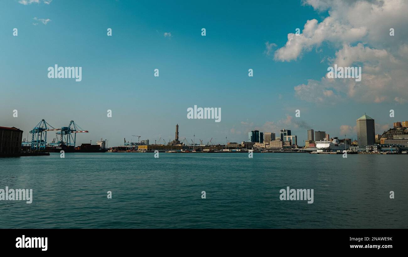 The port of Genova in Italy under the blue sky with fluffy clouds Stock ...