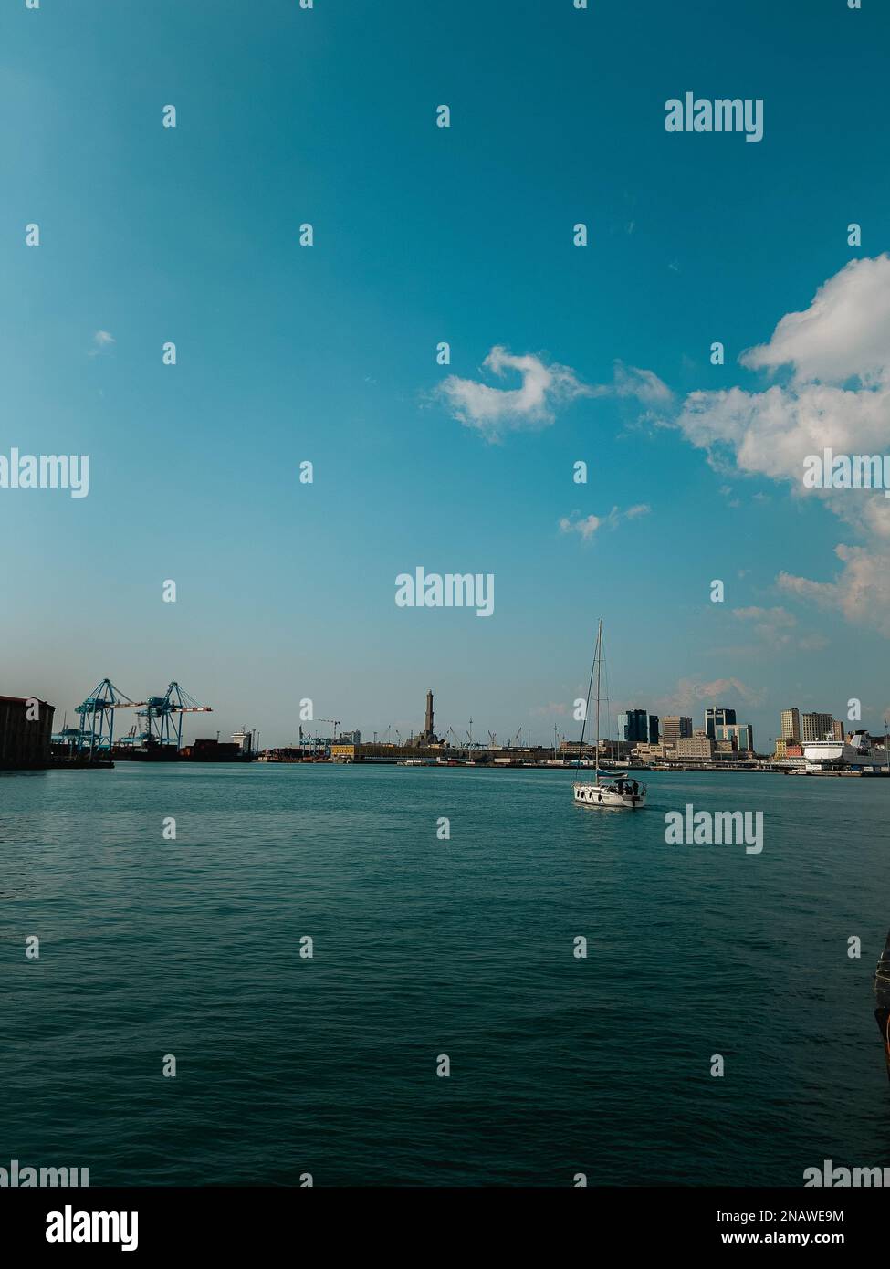 A vertical of the port of Genova in Italy under the blue sky with ...