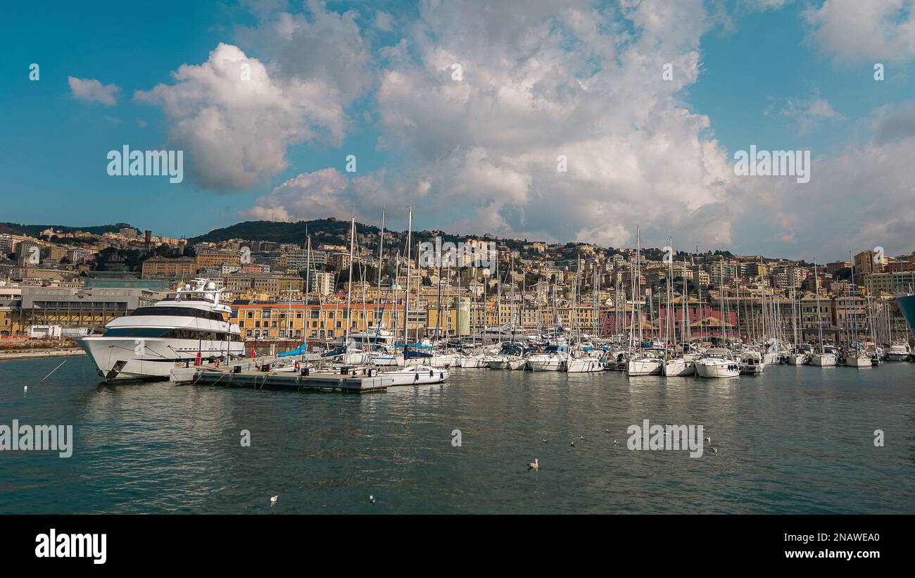 The ships in Genova port, Genoa seaport in Italy, under the blue sky ...