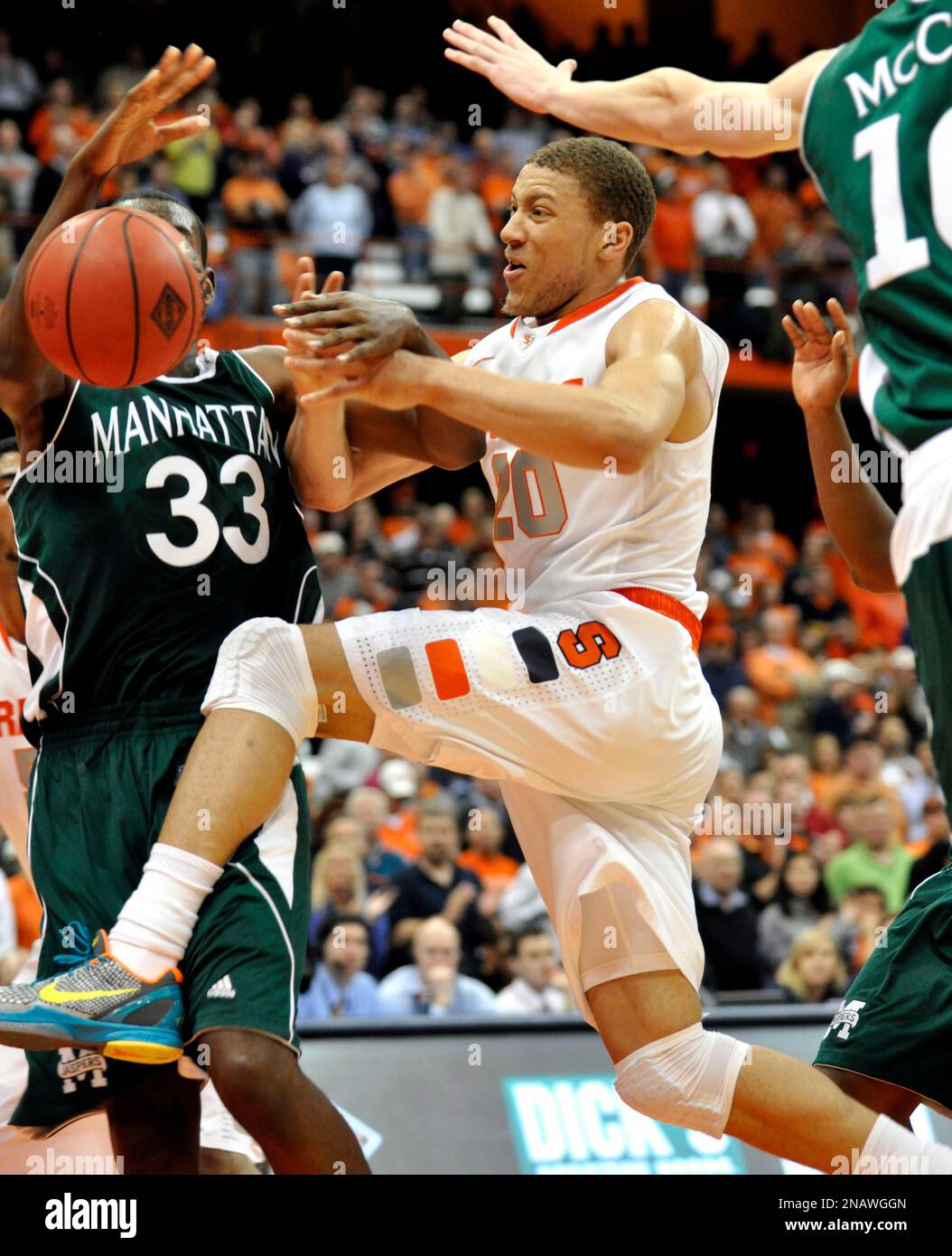 Syracuse's Brandon Triche loses control of the ball under the basket ...