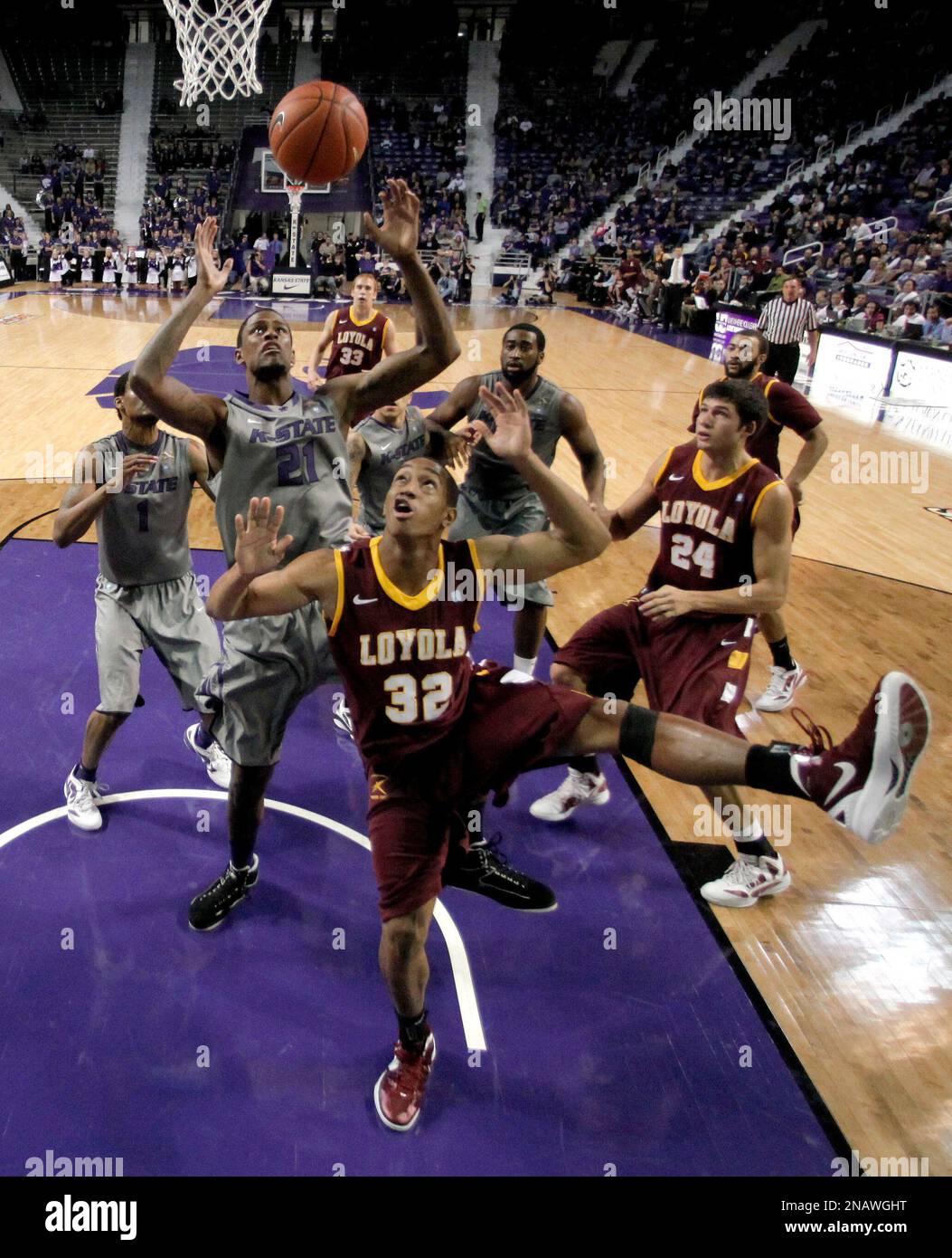 Kansas State center Jordan Henriquez (21) and Loyola Chicago's ...