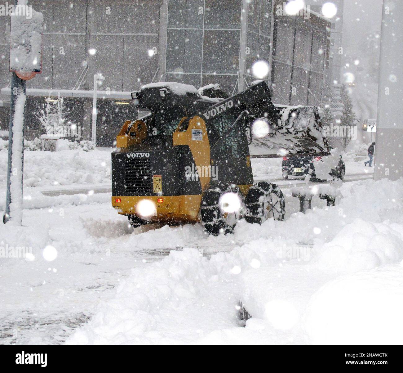 A snow plow clears streets in Juneau, Alaska on Monday, Nov. 14, 2011 ...