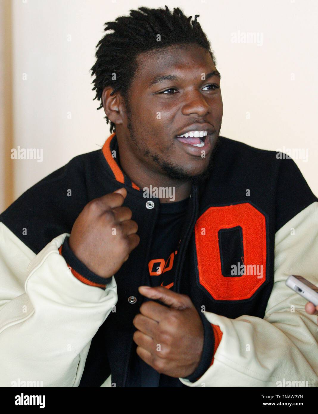 Oklahoma State defensive tackle Nigel Nicholas gestures as he answers a ...