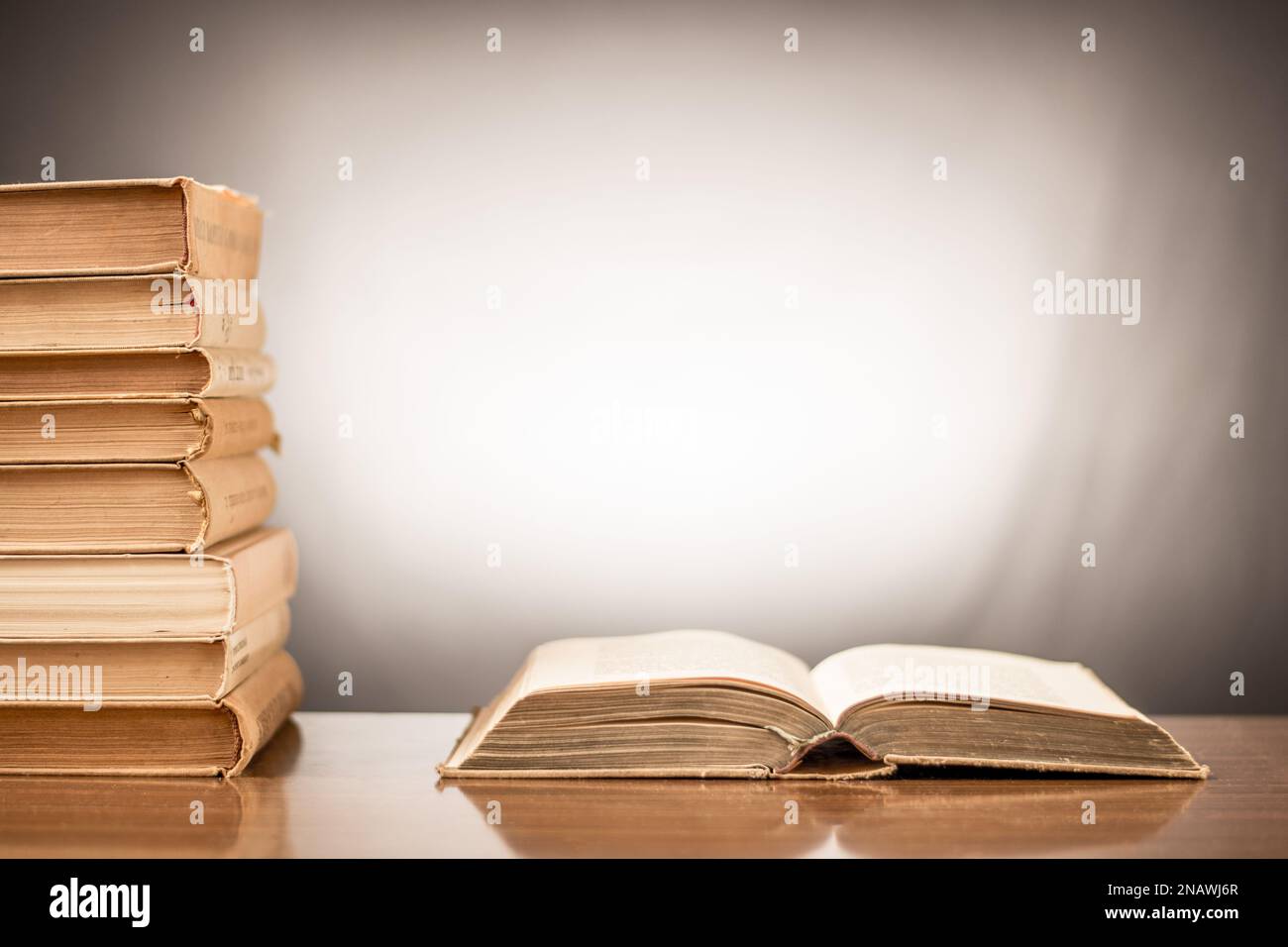 Many stacks of educational books at home preparing for exams on a white ...