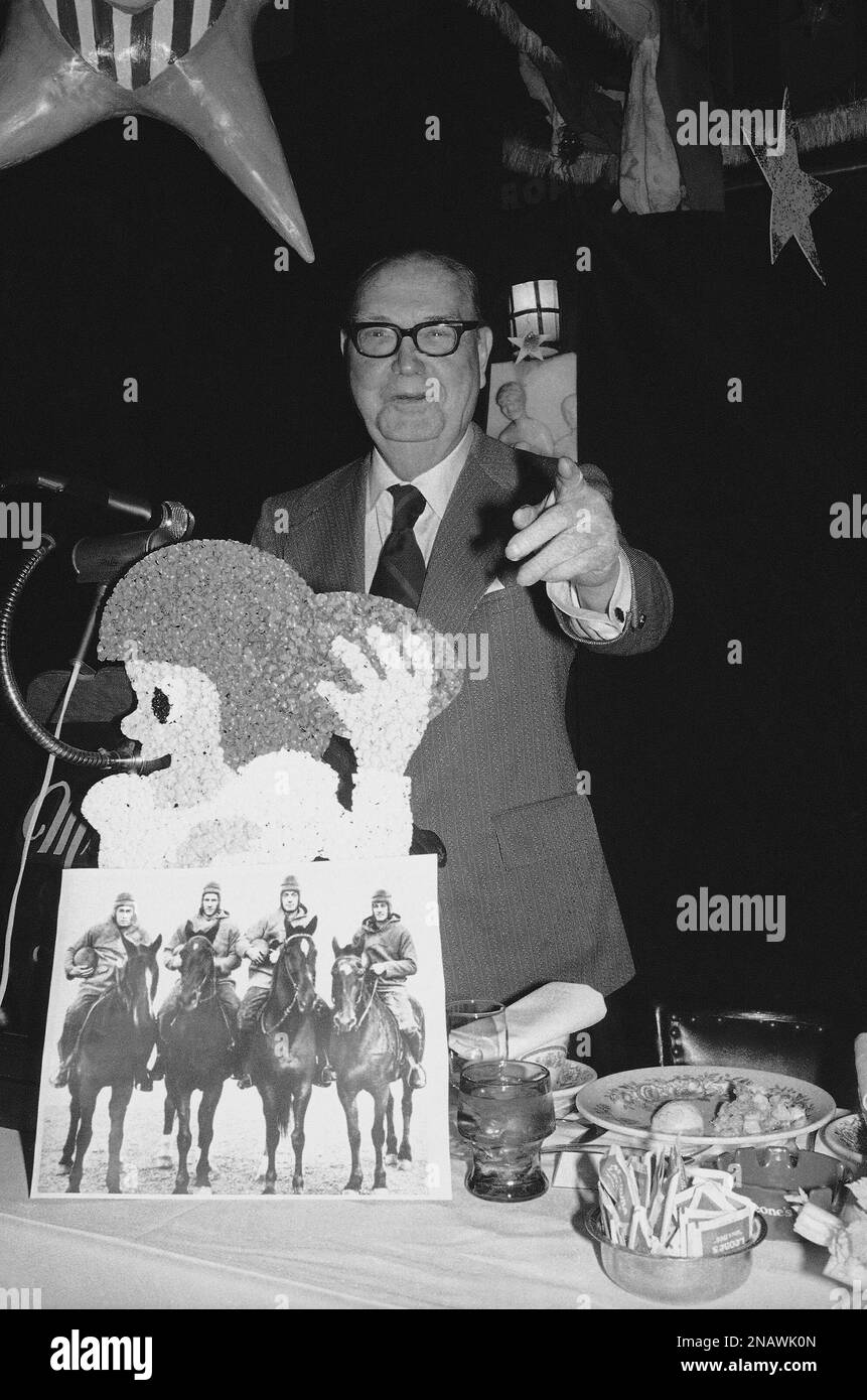 Jim Crowley, one of the former “Four Horsemen of Notre Dame” gestures ...