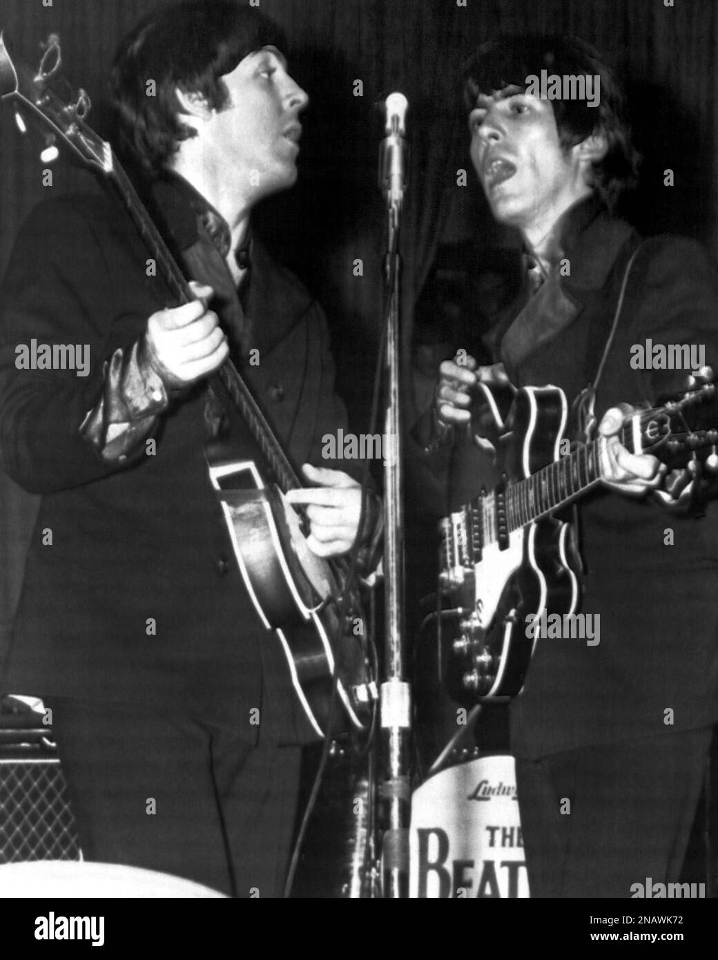 Two members of The Beatles, Paul McCartney, left, on base bultar, and ...