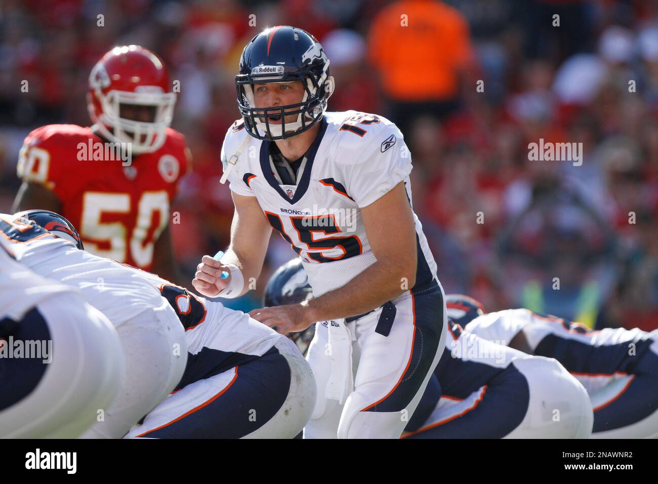 Denver Broncos quarterback Tim Tebow (15) calls out plays to his line ...