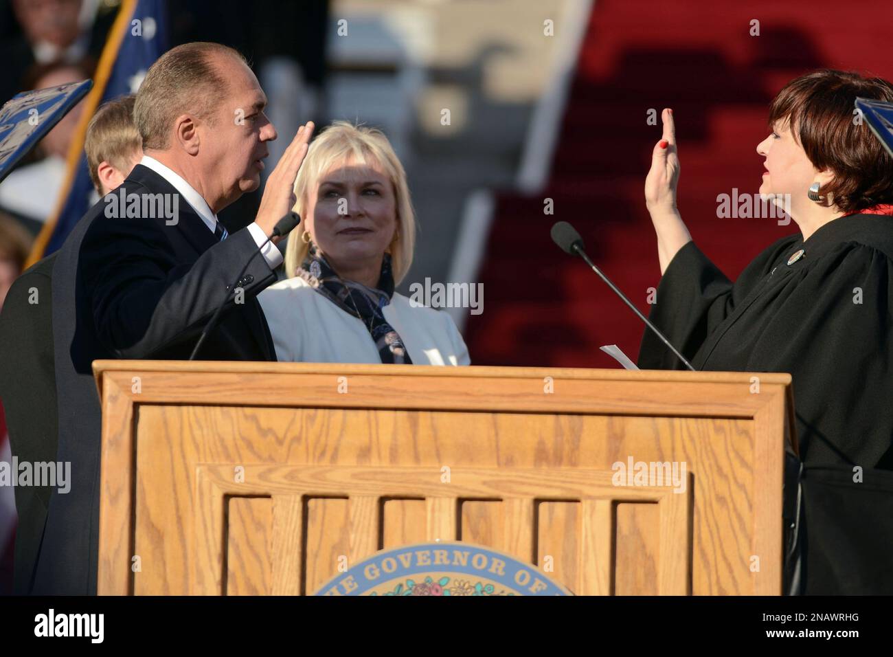 West Virginia Gov. Earl Ray Tomblin, left, takes the oath of office ...