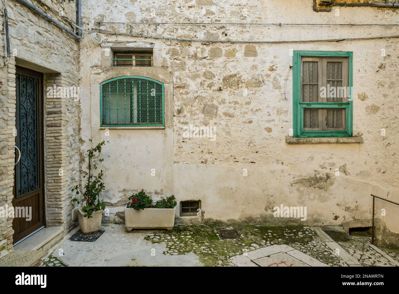 The facade of an old house of Bovino, an ancient town in Puglia, Italy ...