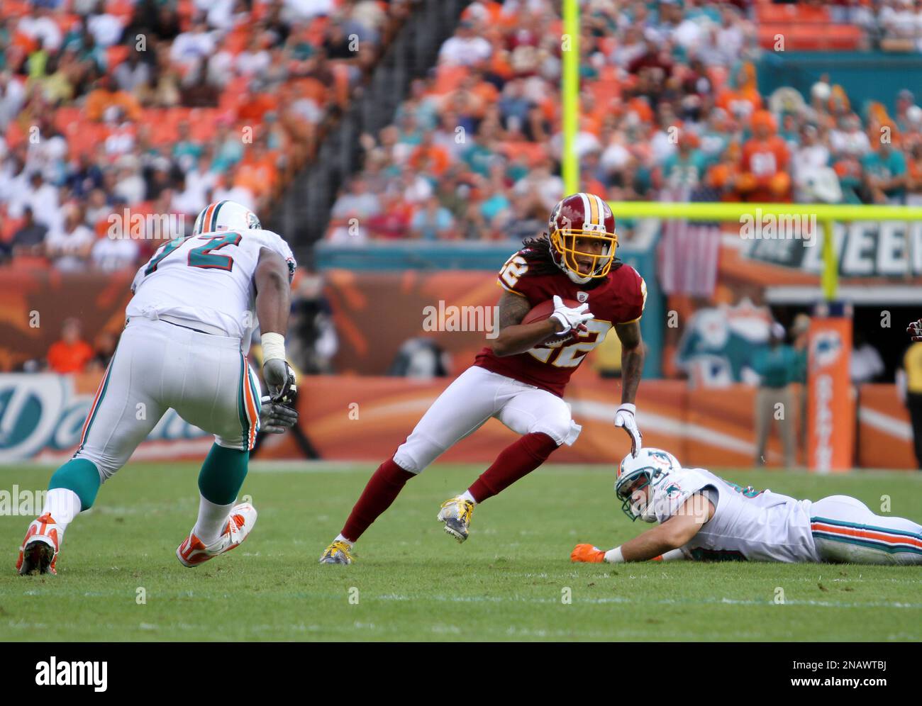 Washington Redskins defensive back Kevin Barnes, center, runs for ...