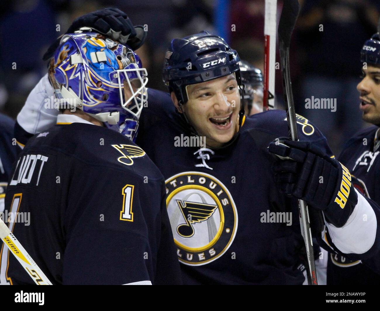 St. Louis Blues goalie Brian Elliott, left, and teammate Chris Stewart ...