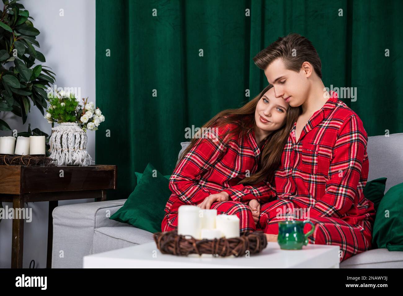 girl resting her head on boyfriend's shoulder at photo shoot Stock ...