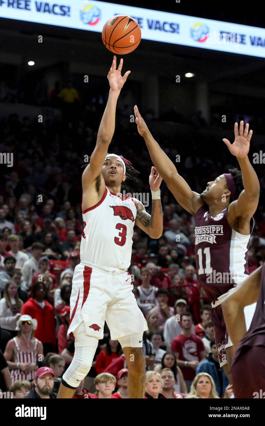 Arkansas guard Nick Smith Jr. (3) shoots over Mississippi State guard ...