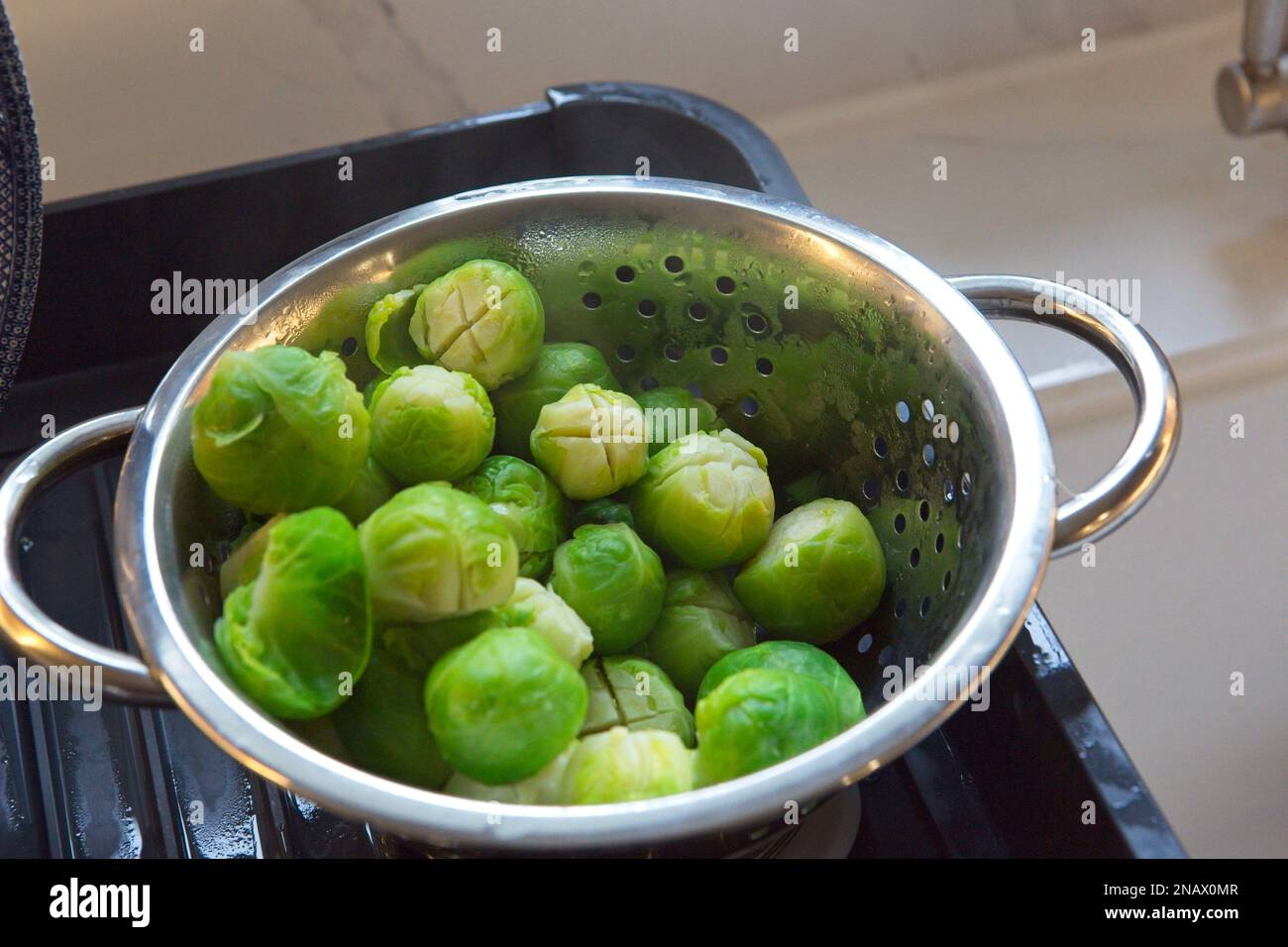 Brussel sprouts boiled and trimmed ready for stir-frying Stock Photo ...