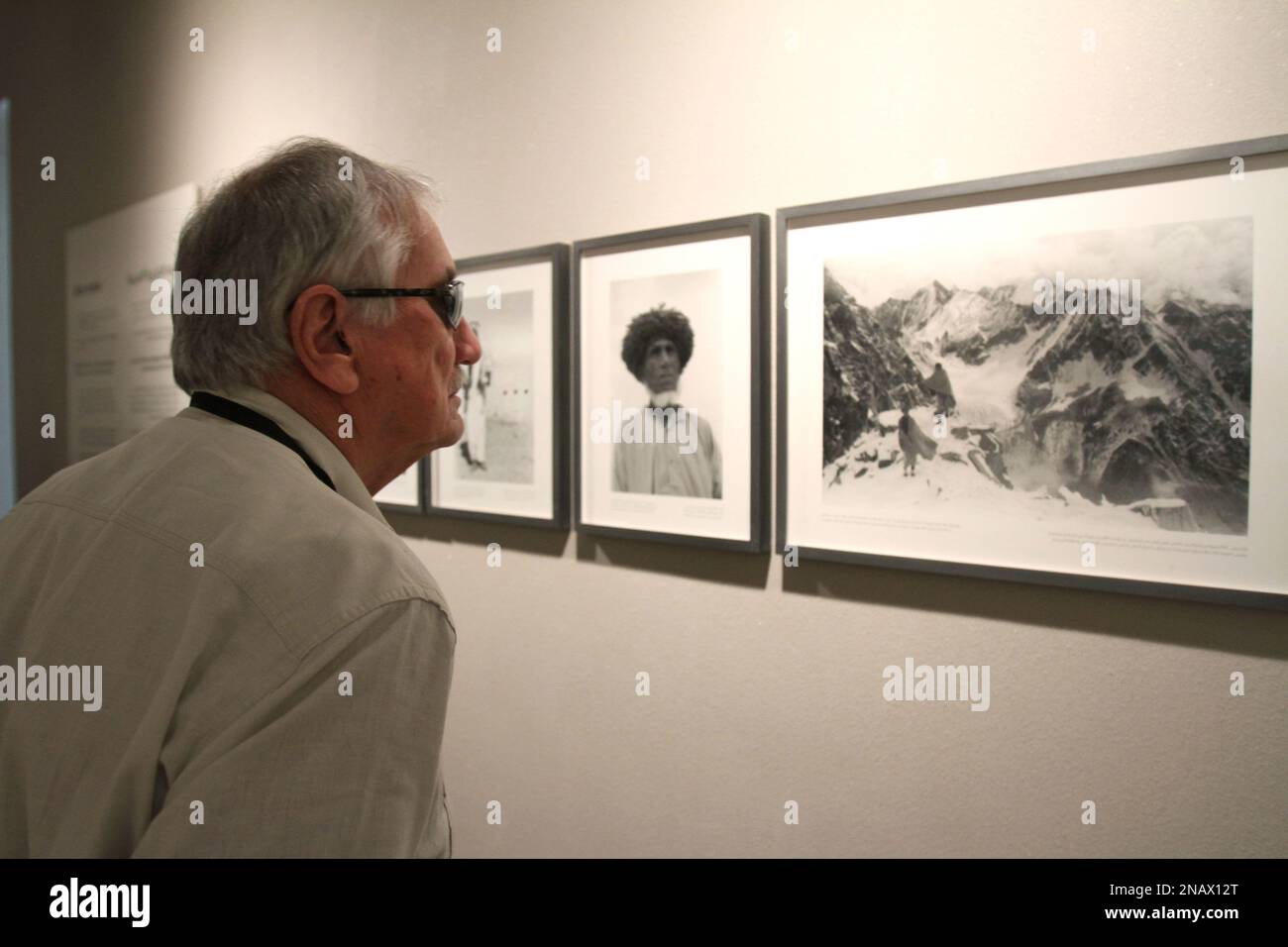 Bruce Hodge, president of Goway.com, look at the wall frames at Al ...