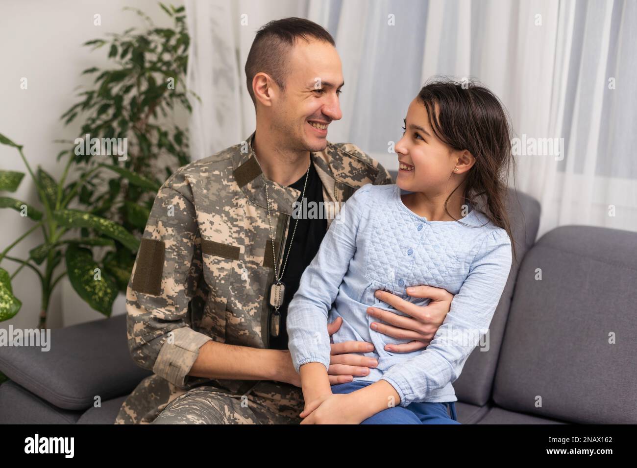 military father hugging his daughter Stock Photo - Alamy