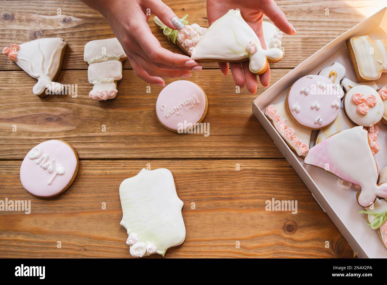 Female hands icing gingerbread cookies hi-res stock photography and ...