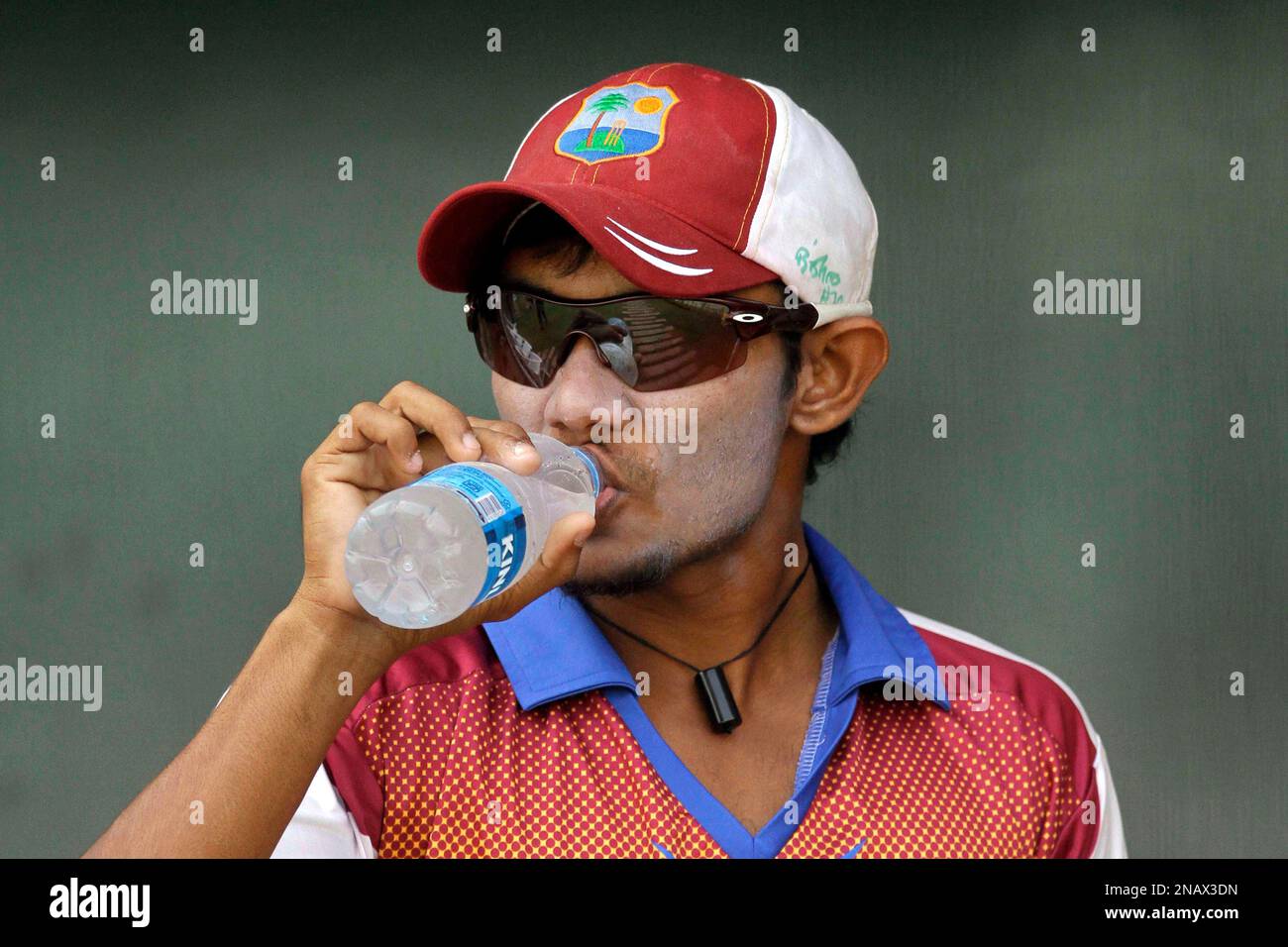 West Indies' cricketer Devendra Bishoo takes a drink during a practice ...