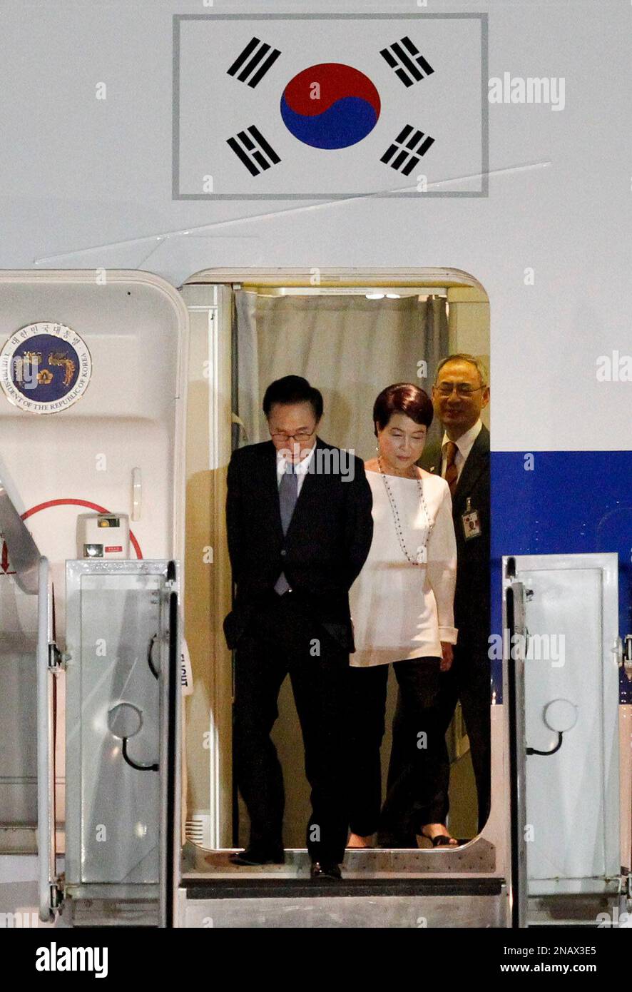 South Korean President Lee Myung-bak and his wife Kim Yoon-ok arrive at ...